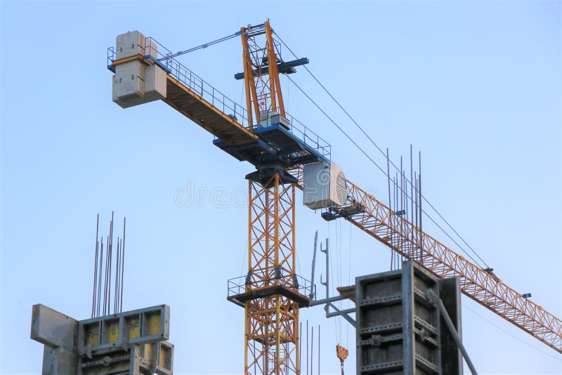 A Crane at Work on a Building Site in the City, Against Sky. Stock ...