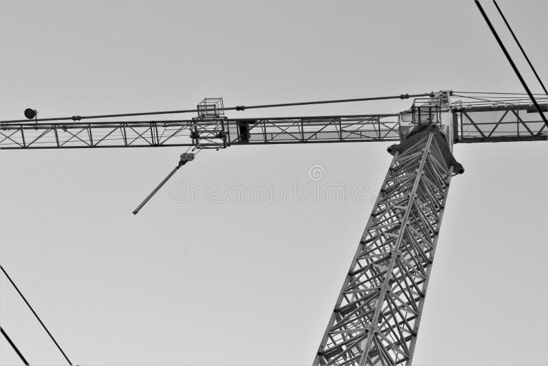 A Crane at Work on a Building Site in the City, Against Sky. Stock ...