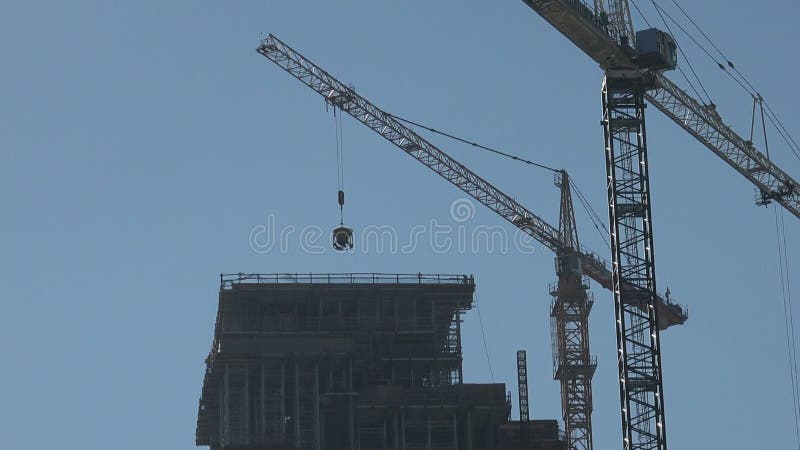 A Crane is Working on the Construction of a Multi-storey Building in a ...