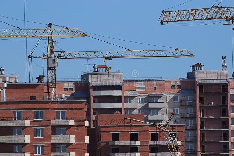 Cranes building a house stock image. Image of block, cranes - 55327703