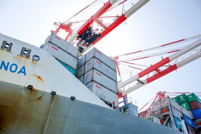 Cranes and cargo ship editorial stock photo. Image of harbor - 178013053