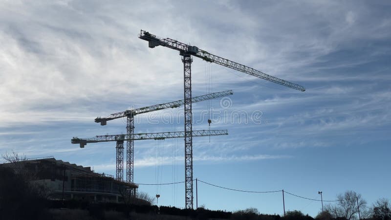 3 Cranes Construction. Cranes at the Construction Site are Moving ...
