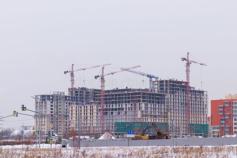 Cranes on the Construction Site. Construction of a Modern Residential ...