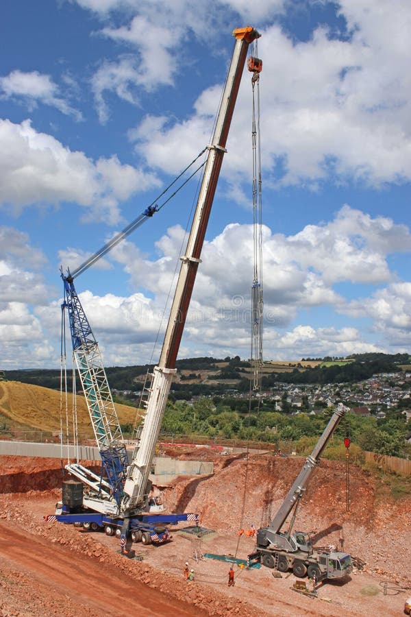 Cranes laying a new bridge stock photo. Image of dump - 99240816