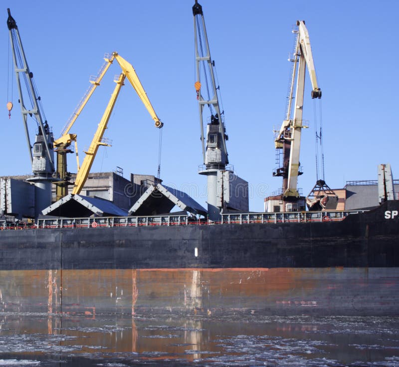 Cranes Loading Cargo Ship_Tanker Truck_Economy Stock Photo - Image of ...
