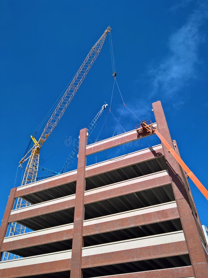 Cranes and Workers Erect Building. Teamwork and Construction Stock ...