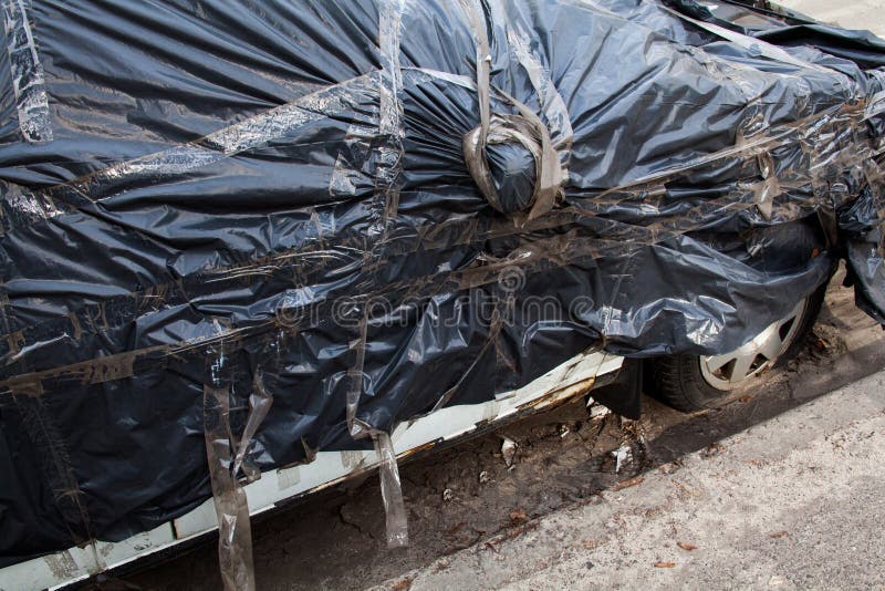 Crashed Car Wrapped in Plastic Sheeting Stock Image - Image of ...