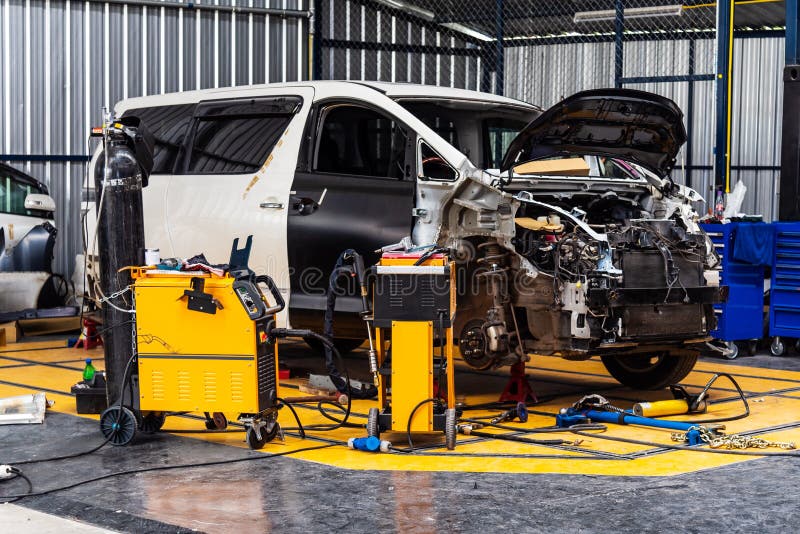 The Crashed Cars are Being Repaired Inside the Garage Auto Service ...