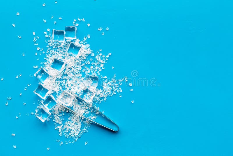 Crashed Ice Cubes with Barman Tools on Blue Kitchen Table Top View Mock ...