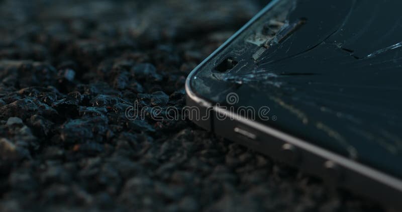 Crashed Smartphone Rests on the Road S Asphalt. Stock Video - Video of ...