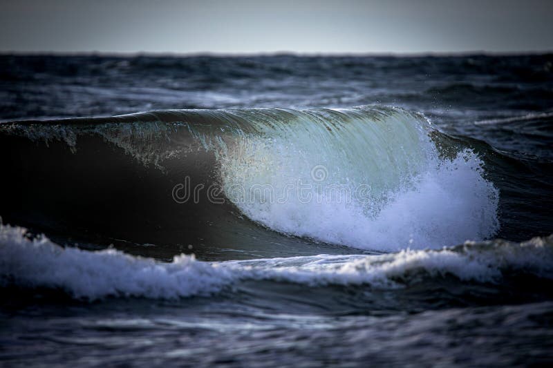 Crashing Ocean Wave Curling in Dark Deep Waters Stock Image - Image of ...
