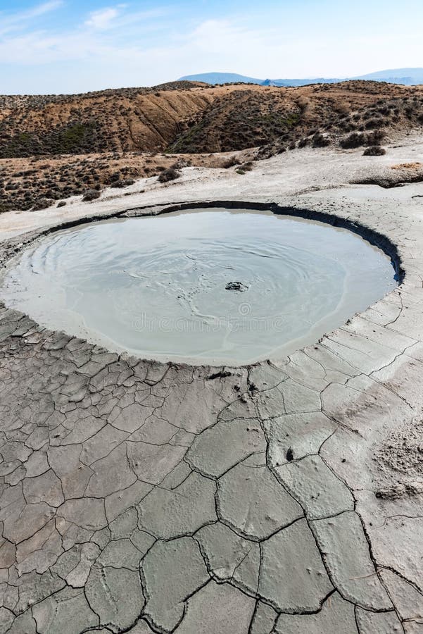 Crater of a mud volcano stock photo. Image of field, bubbling - 69642360