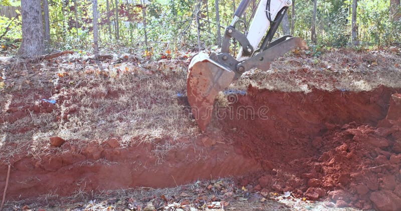 A Crawler Excavator Bucket Digging the Ground during Earthmoving Works ...