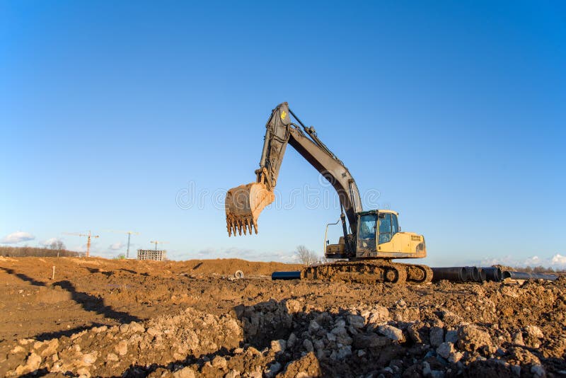Crawler Excavator at a Construction Site during Digging Ground for ...
