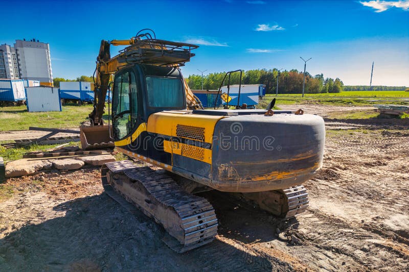 Crawler Excavator Machine Unloading Sand or Soil at Construction Area ...