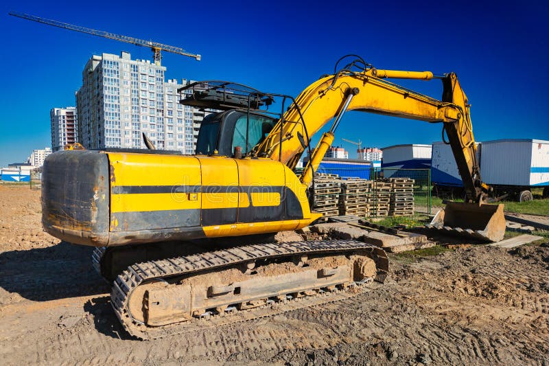 Crawler Excavator Machine Unloading Sand or Soil at Construction Area ...