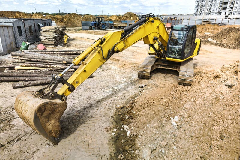 Crawler Excavator Machine Unloading Sand or Soil at Construction Area ...
