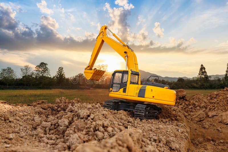 Crawler Excavators are Digging Soil at Construction Site and Laying ...