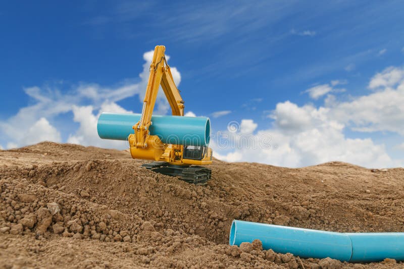Crawler Excavators are Digging Soil at Construction Site and Laying ...