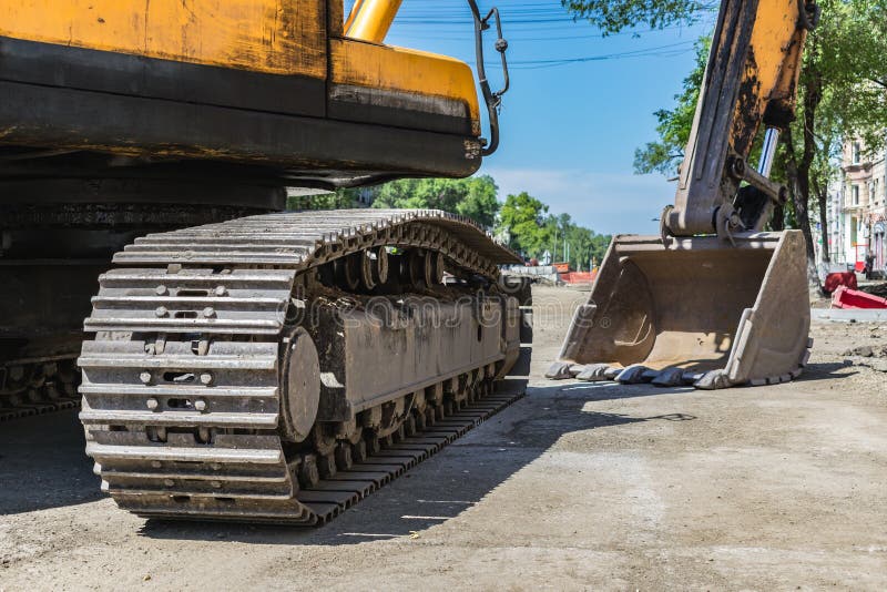 Crawler Tracks and Excavator Bucket at Construction Site Close Up Stock ...