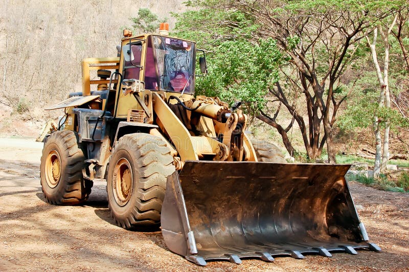 Crawler Yellow Parked in the Woods. Stock Photo - Image of mining ...