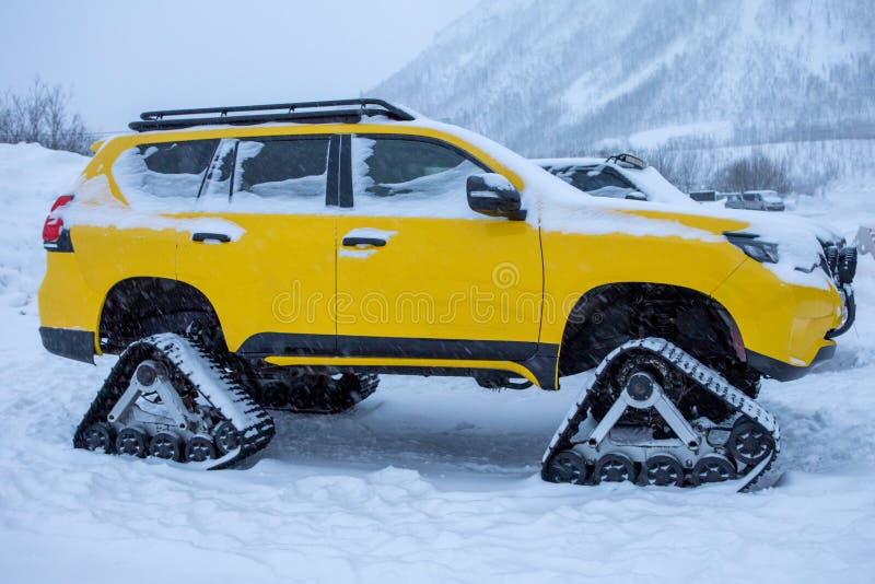 Crawler Yellow Vehicle Direct View in the Winter Snow Stock Image ...