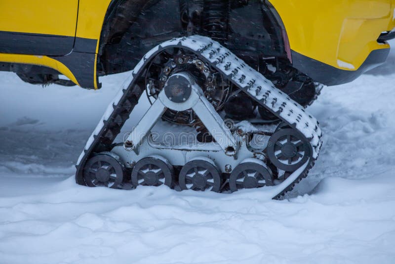 Crawler Yellow Vehicle Direct View in the Winter Snow Stock Photo ...