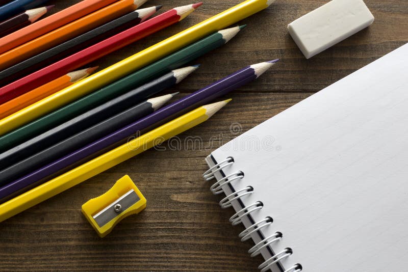 Crayons, Notebook , Eraser and Pencil Sharpener Stock Photo - Image of ...