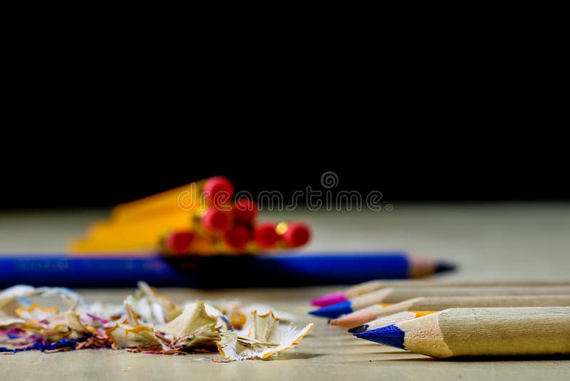 Crayons And Pencil Sharpener On A Wooden Office Table. Crayons W Stock ...