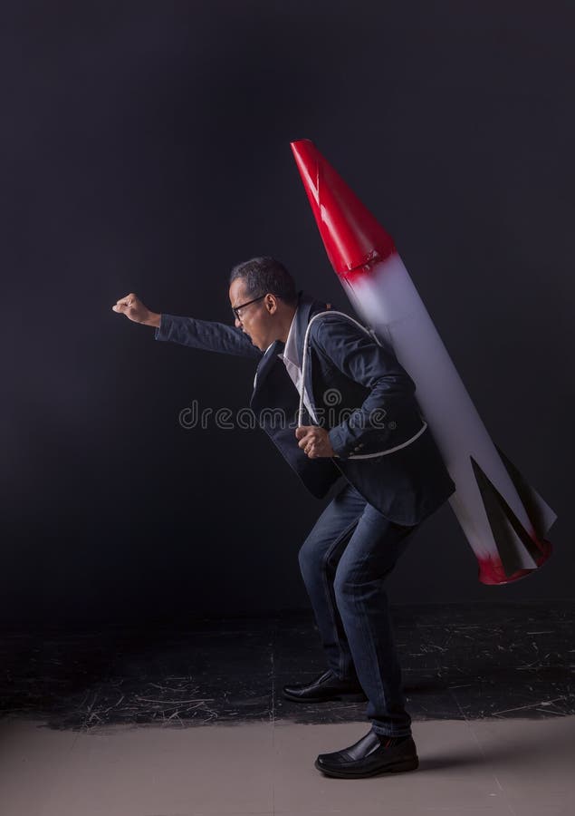 Crazy Business Man Carrying Missile Weapon Standing in Dark Stud Stock ...