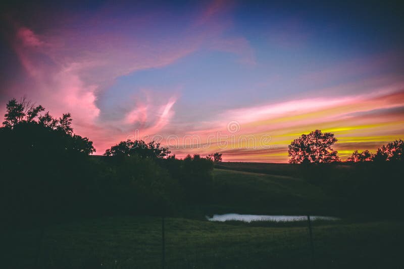 Midwest pasture at sunset stock image. Image of sunrise - 143065859