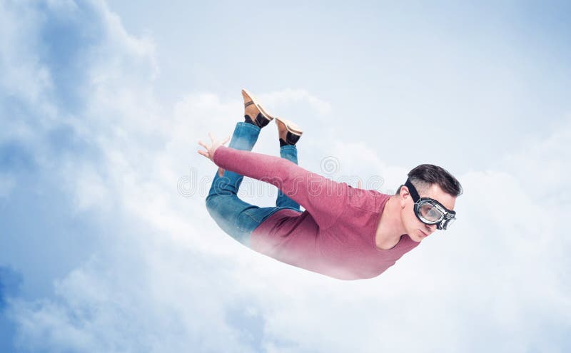 Crazy Man in Goggles is Flying in in the Cloudy Sky. Jumper Concept ...