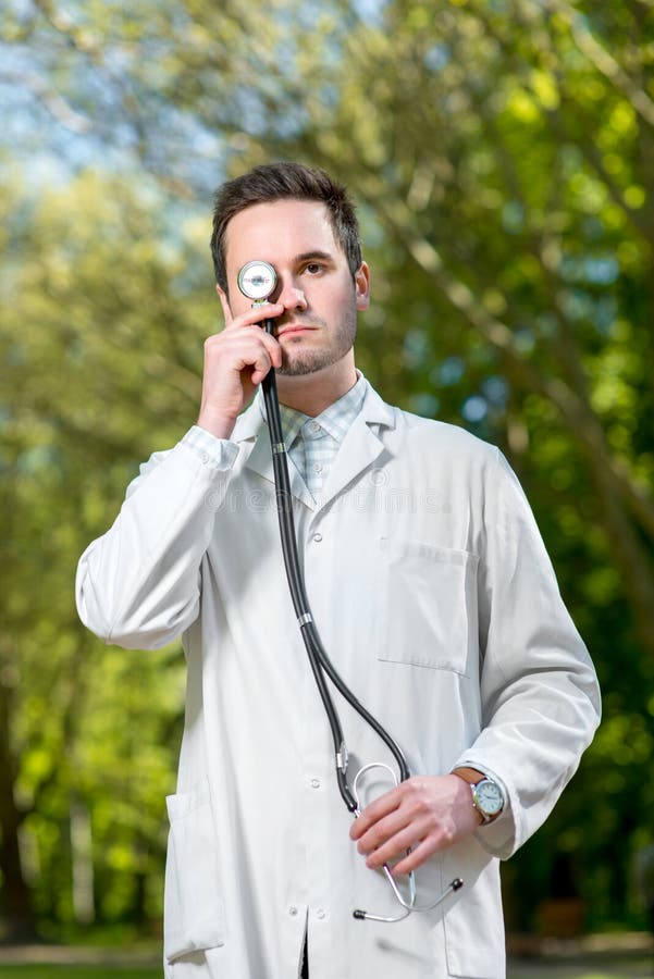 Crazy Doctor with Stethoscope instead His Eye Stock Image - Image of ...