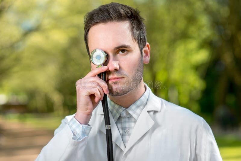 Crazy Doctor with Stethoscope instead His Eye Stock Image - Image of ...