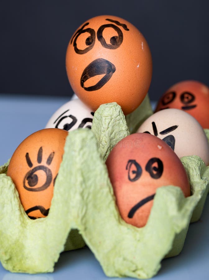 Crazy Eggs Terrified. Scared Faces Peering Out of the Egg Tray Stock ...