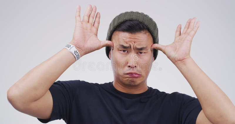 Crazy Expression, Face of Asian Man in Studio with Funny and Positive ...