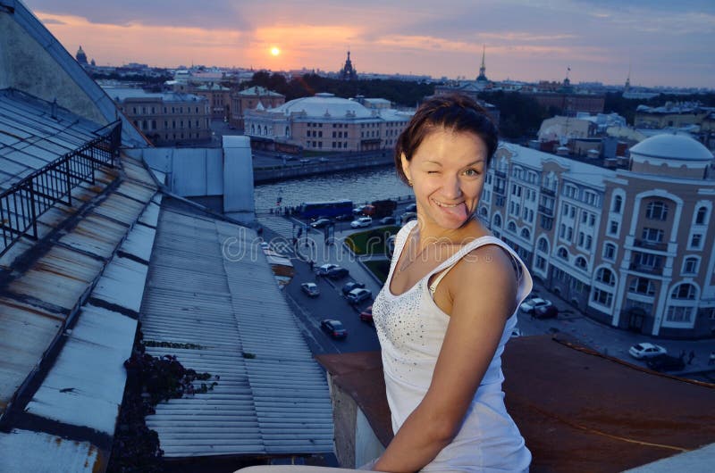 Crazy girl on the roofs stock photo. Image of attractive - 55177260