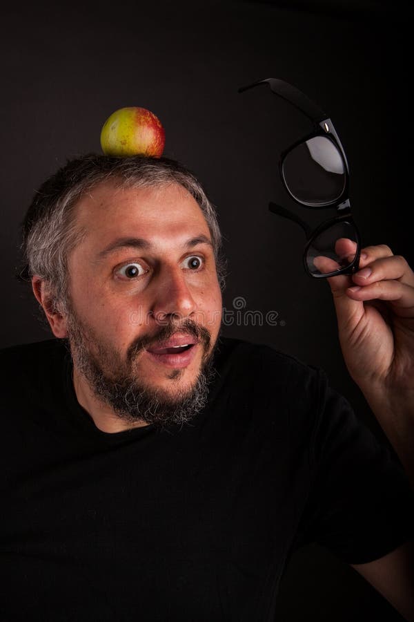 Crazy Looking Grumpy Old Man with Grey Beard and Big Glasses with Apple ...