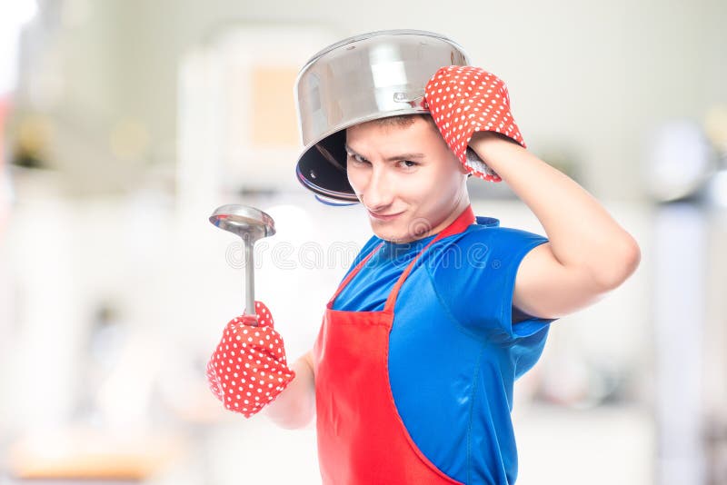 Crazy Man in an Apron with a Pan on His Head Posing Stock Photo - Image ...