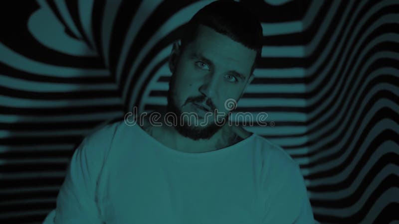 Crazy Man in a Straitjacket in a Psychedelic Room Looks at You Stock ...