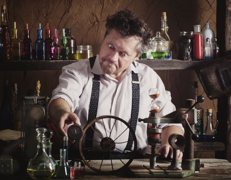 Medieval Scientist Reading Book In His Laboratory Stock Photo - Image ...