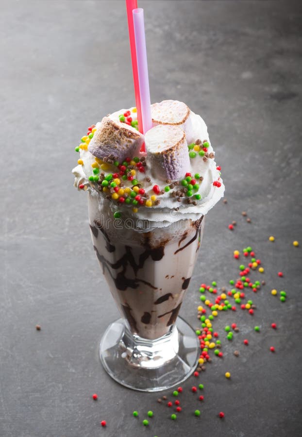 Crazy Milk Shake Decorated with Marshmallows on a Table Stock Photo ...