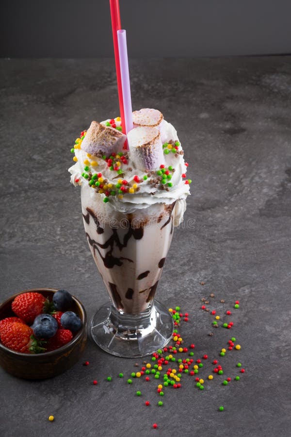 Crazy Milk Shake Decorated with Marshmallows on a Table Stock Photo ...