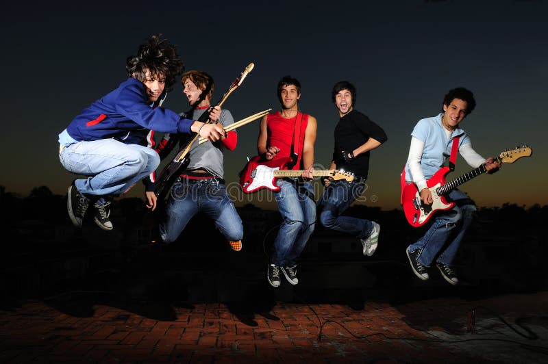 Crazy musical band stock image. Image of jumping, guitar - 6414067