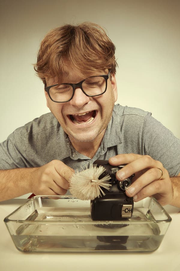 Wrong Way Cleaning Sensor of Digital Camera by Service Man in Water ...