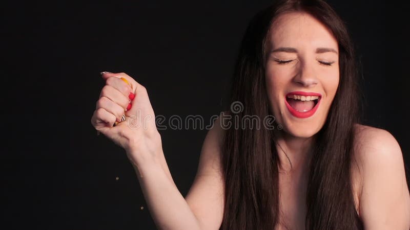 Crazy Young Brunette Squeezing Orange in Hand Stock Footage - Video of ...