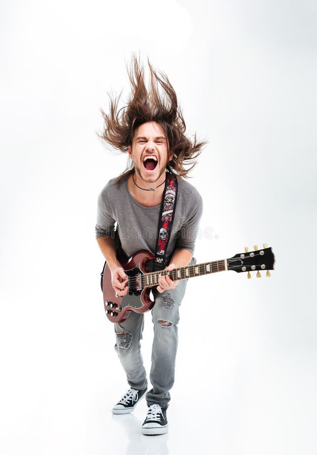 Crazy Young Man Shaking Head and Playing Electric Guitar Stock Photo ...
