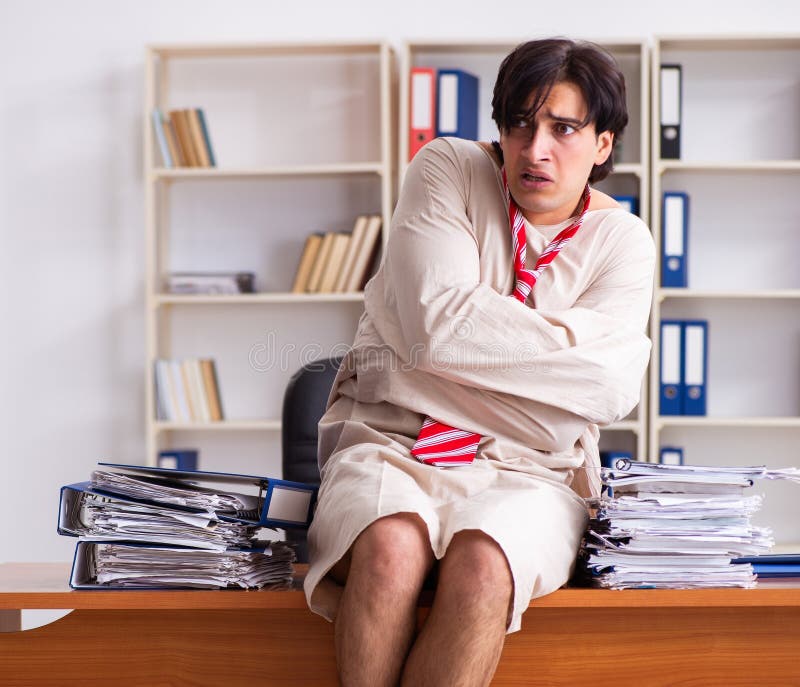 Crazy Young Man in Straitjacket at the Office Stock Photo - Image of ...