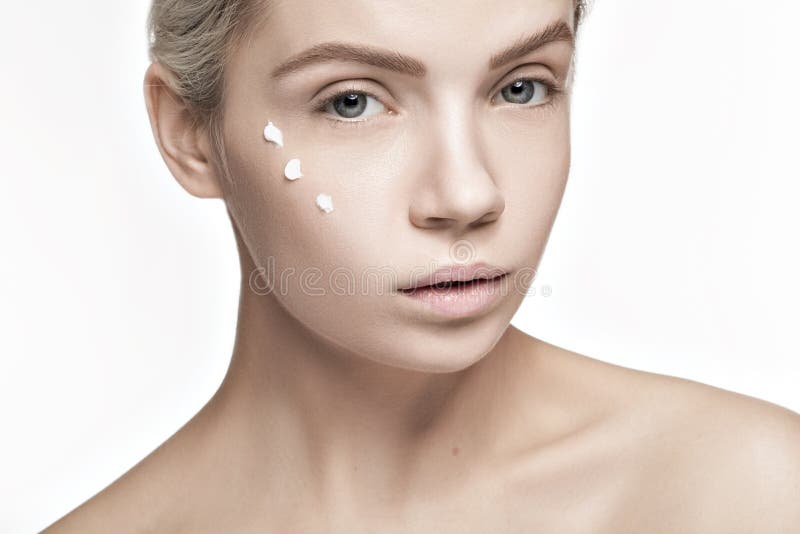 Cream and Beauty. Woman with Drops of Cream on Face Stock Photo - Image ...
