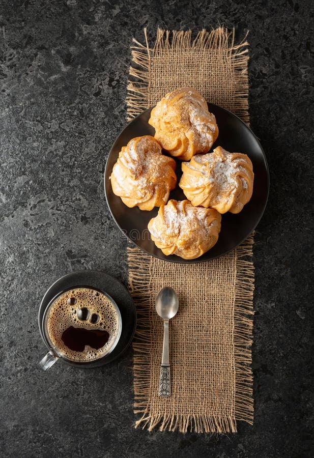 Cream Cakes and Black Coffee on a Black Table Stock Image - Image of ...